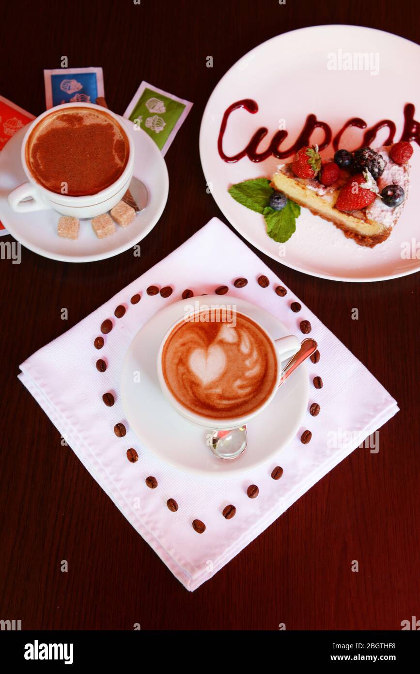 Cup of coffee with cute drawing in cafe Stock Photo - Alamy