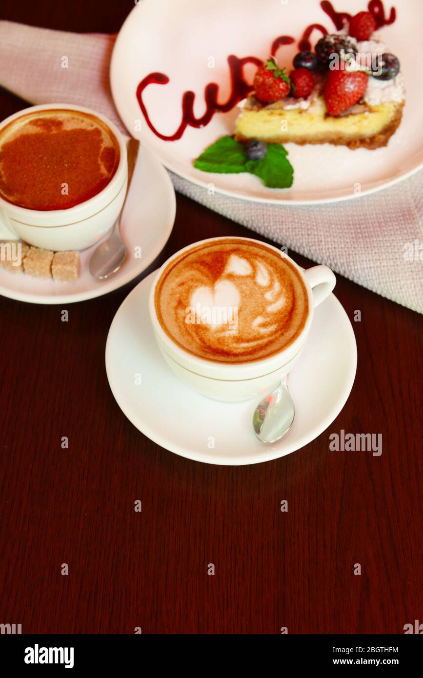 Cup of coffee with cute drawing in cafe Stock Photo - Alamy