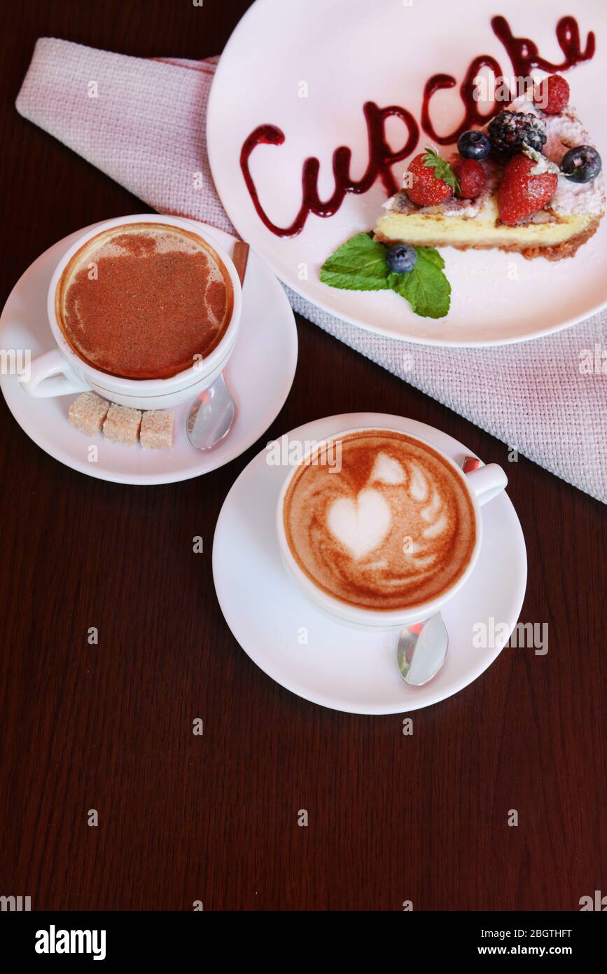 Cup of coffee with cute drawing in cafe Stock Photo - Alamy