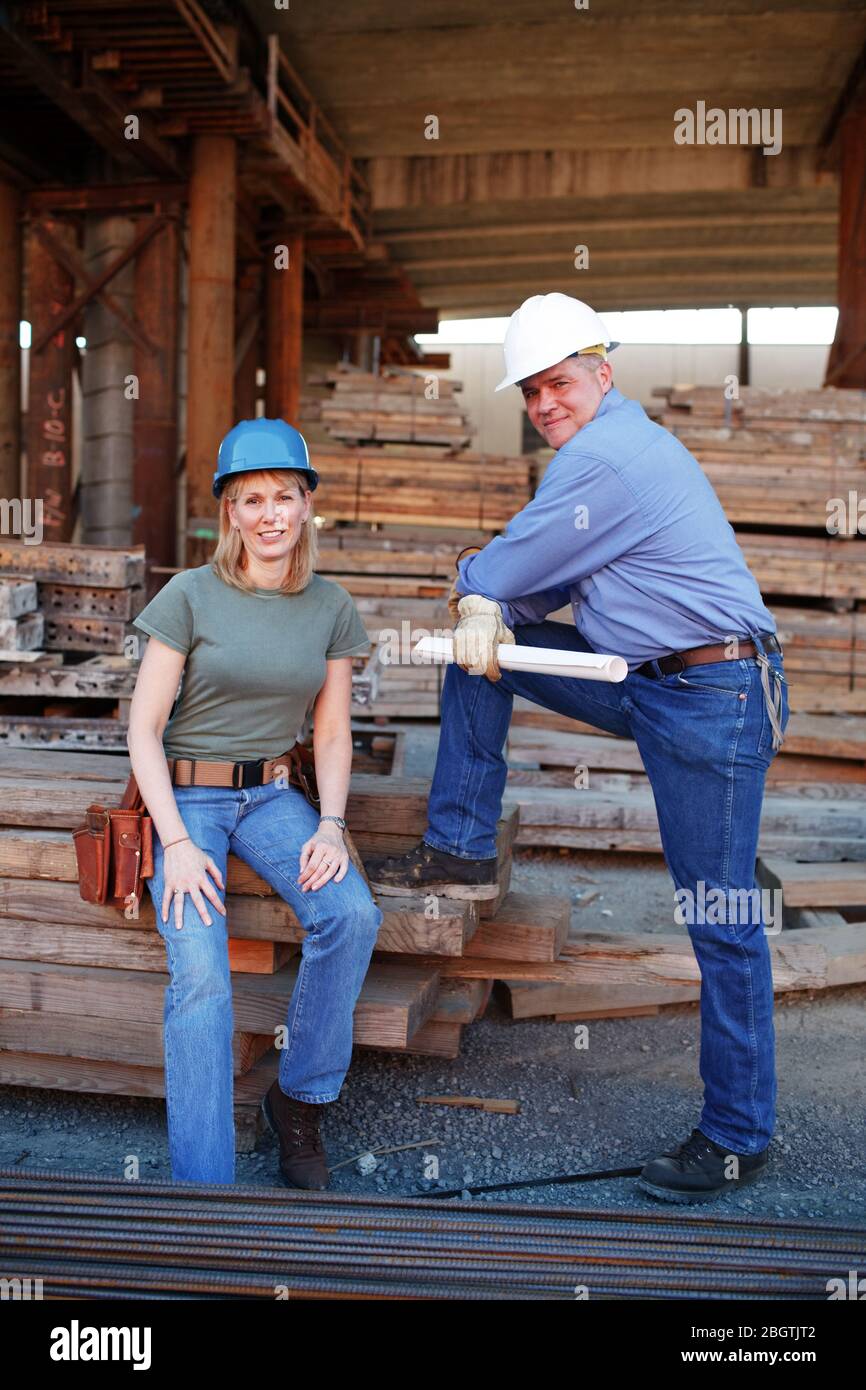 Portrait of male and female construction workers Stock Photo - Alamy