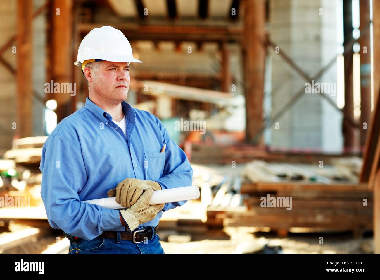 Construction holding building plans hi-res stock photography and images ...