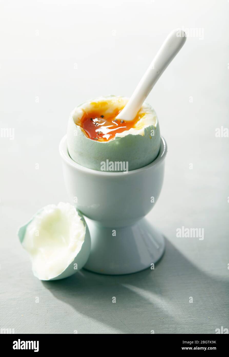 Soft Boiled Egg Cracked Open with Spoon Stock Photo - Alamy