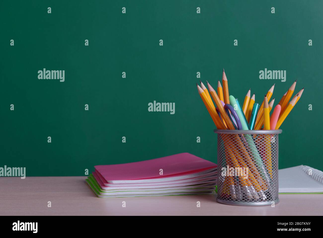 School supplies on table on board background Stock Photo - Alamy