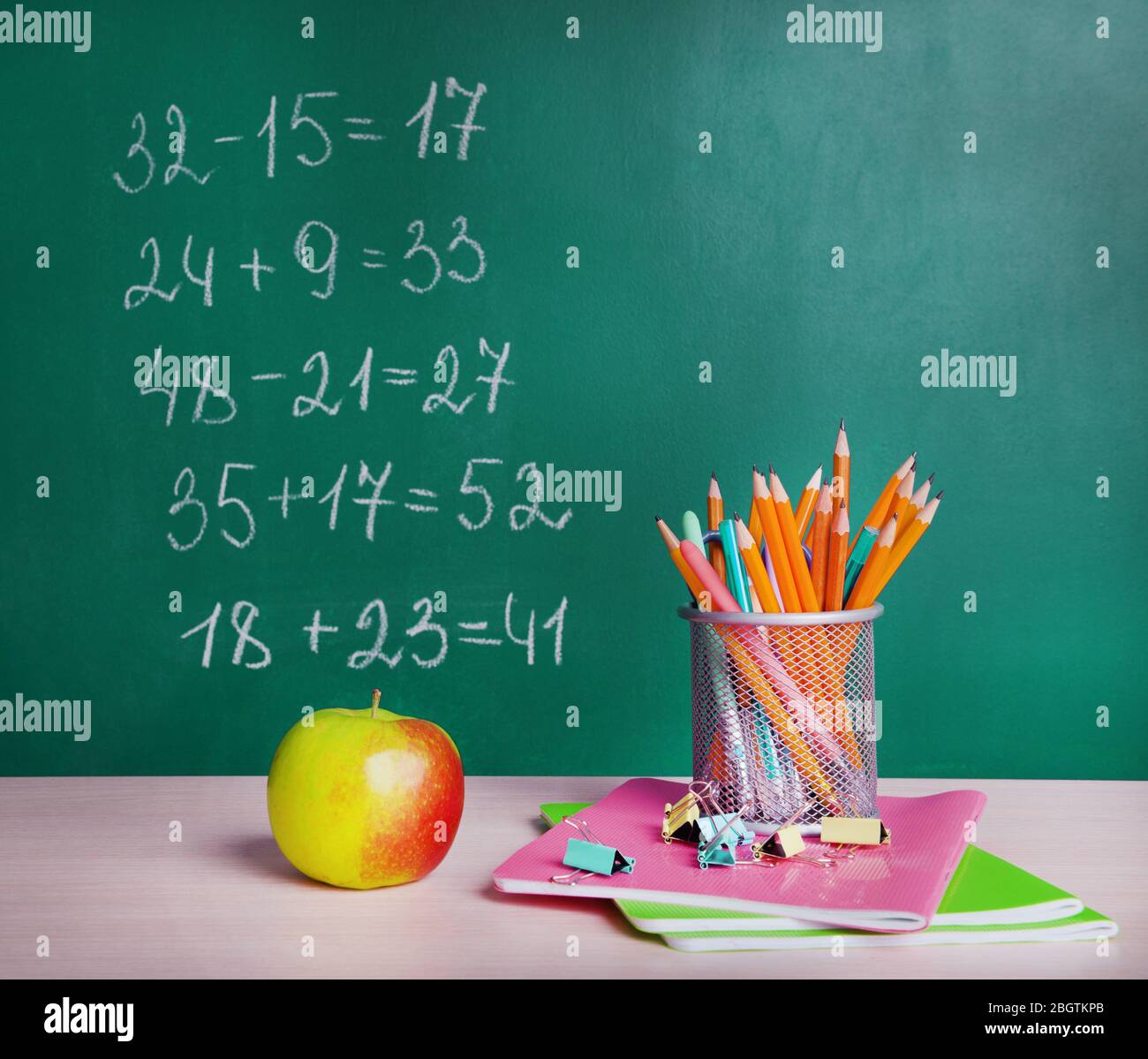 School supplies on table on board background Stock Photo - Alamy