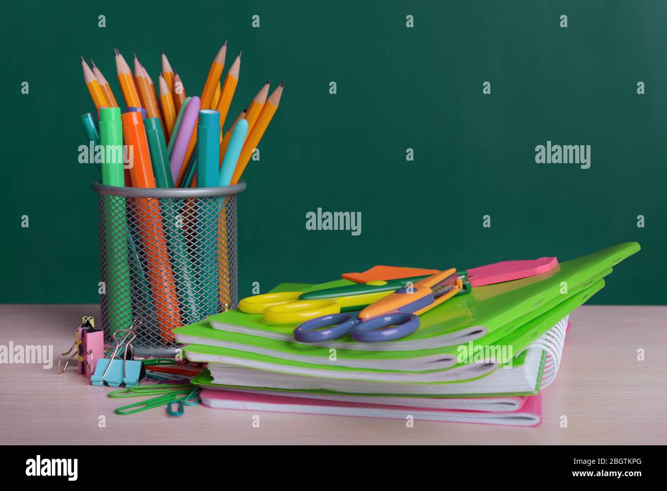 School supplies on table on board background Stock Photo - Alamy