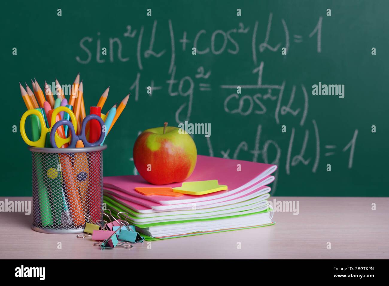 School supplies on table on board background Stock Photo - Alamy
