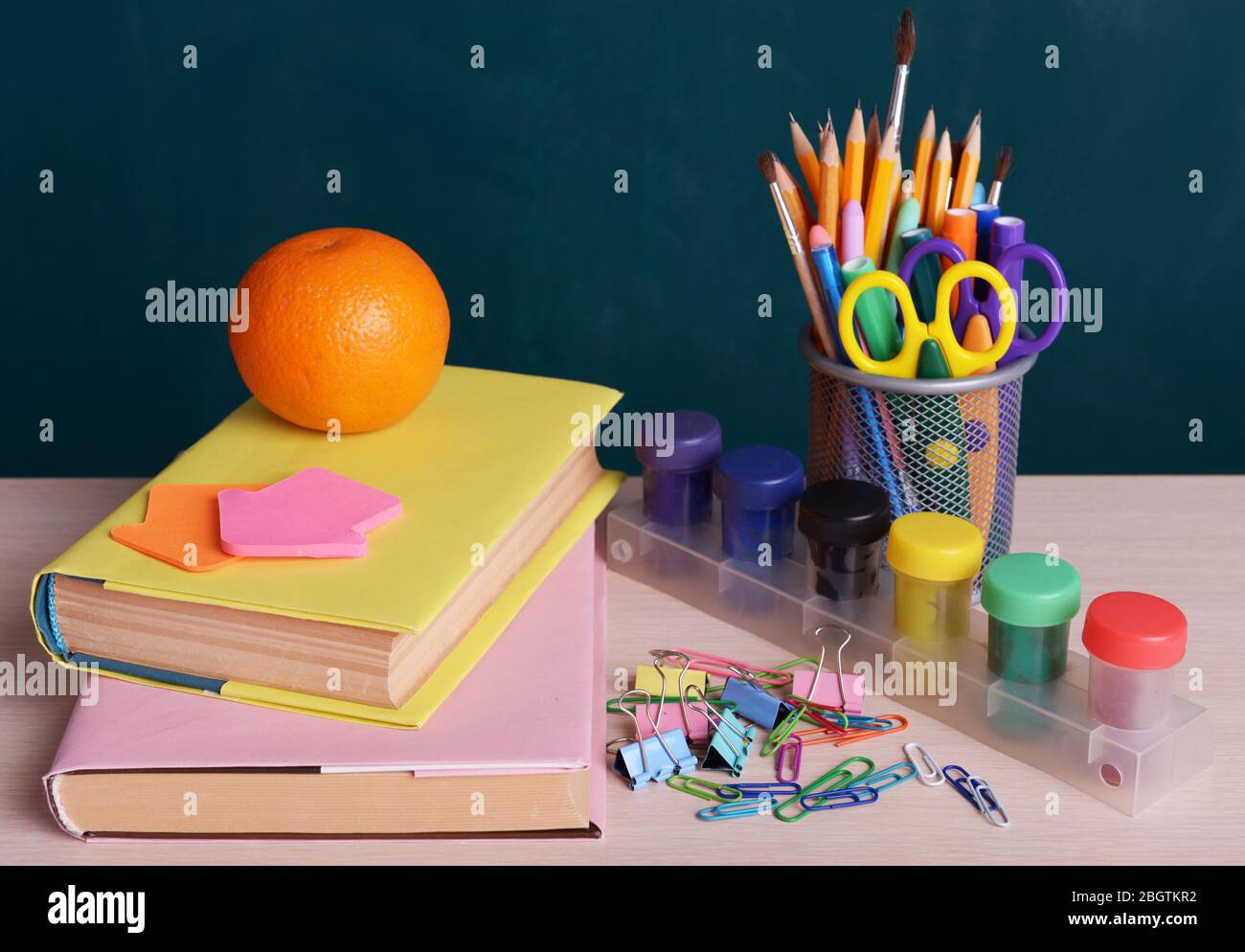 School supplies on table on board background Stock Photo - Alamy