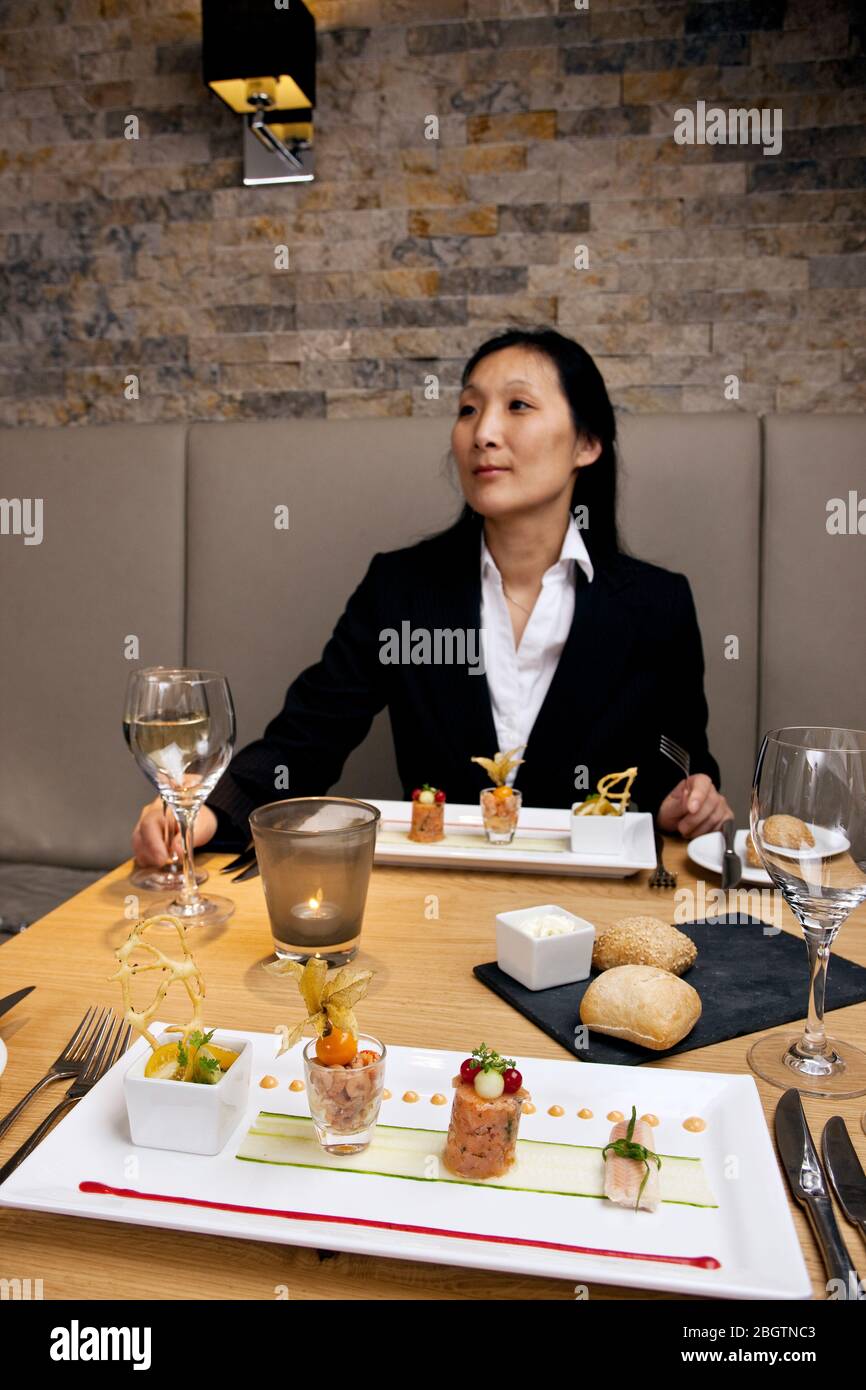 Businesswoman eating at restaurant in a luxury hotel Stock Photo - Alamy
