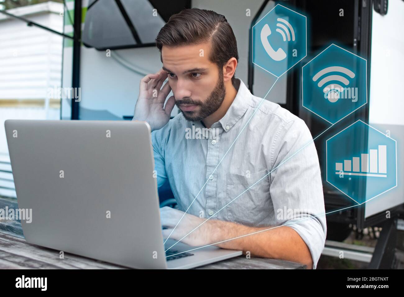 Hologram projections of symbols from a computer shoot around a man with ...