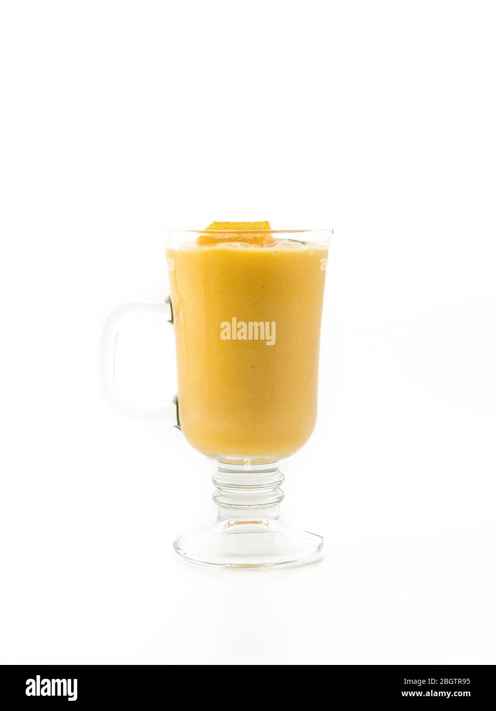 fresh mango smoothie on white background Stock Photo - Alamy