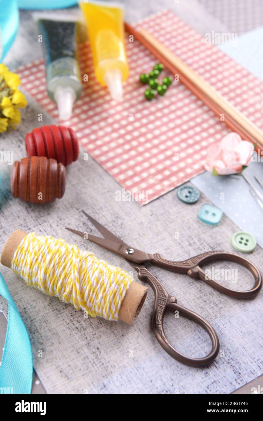 Scrapbooking craft materials on bright background Stock Photo - Alamy