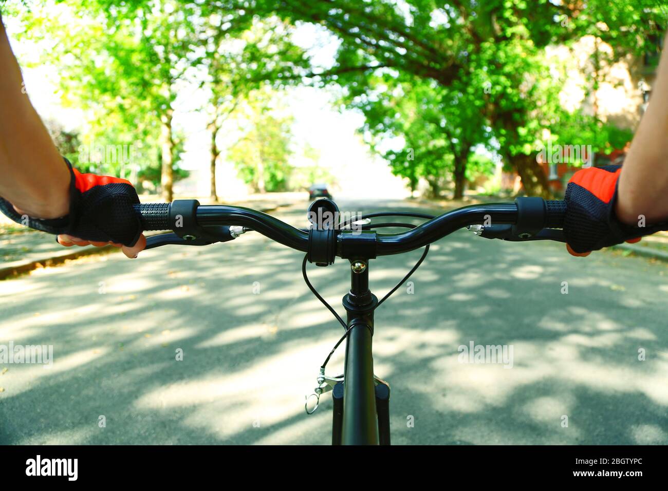 Man biking fast in city park. View from bikers eyes Stock Photo - Alamy