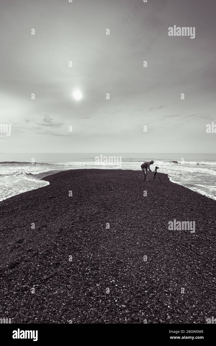 Photographer on shingle shore- Shingle Street, June 2016 Stock Photo ...