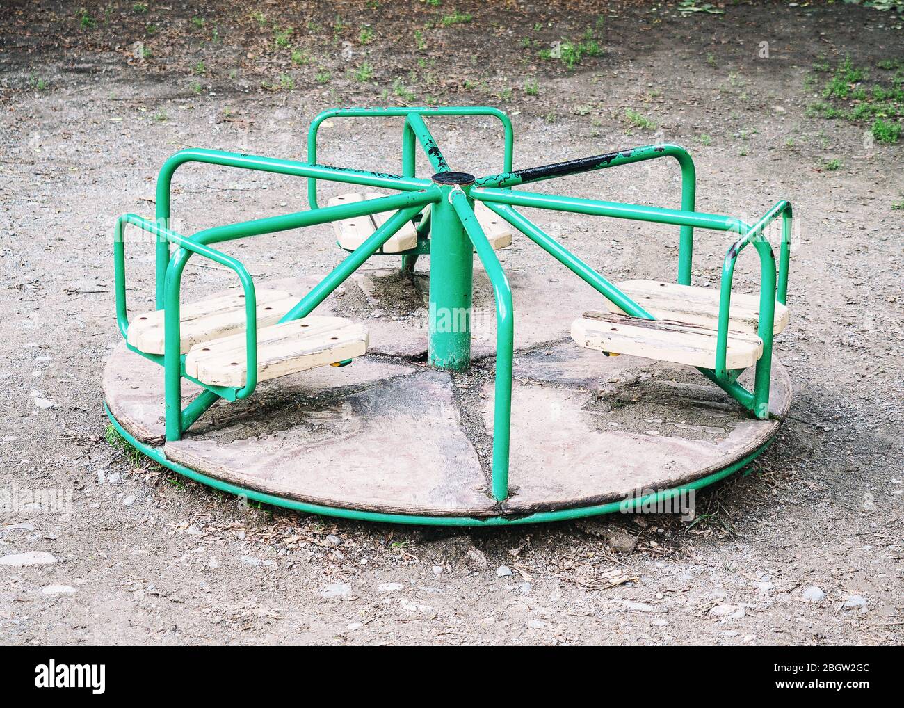 Round green swing in the playground on street Stock Photo - Alamy