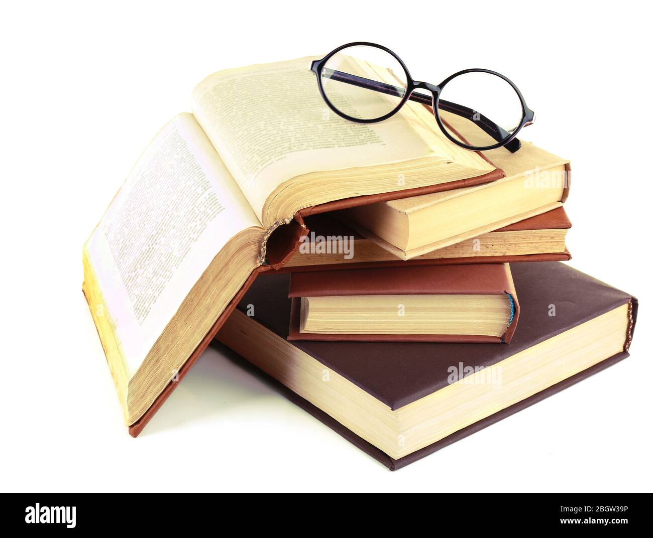 Books in a mess and glasses isolated on white Stock Photo - Alamy