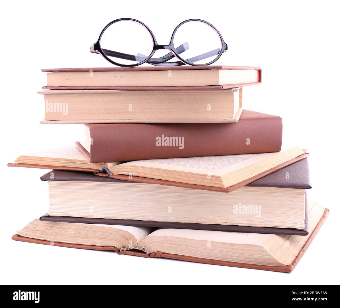 Books in a mess and glasses isolated on white Stock Photo - Alamy