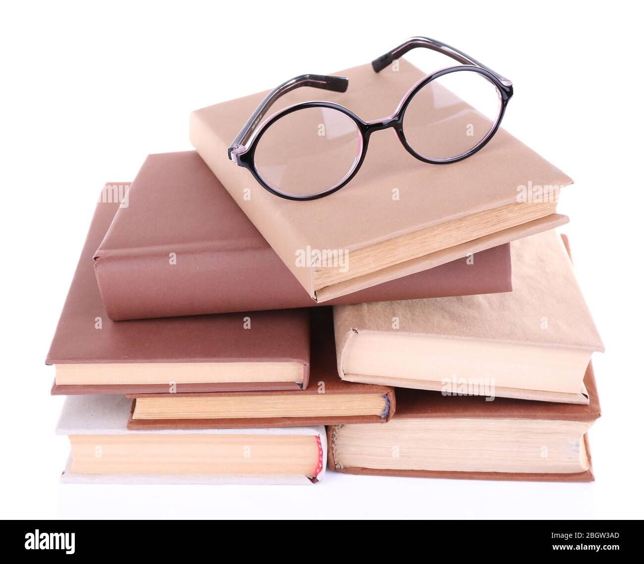 Books in a mess and glasses isolated on white Stock Photo - Alamy