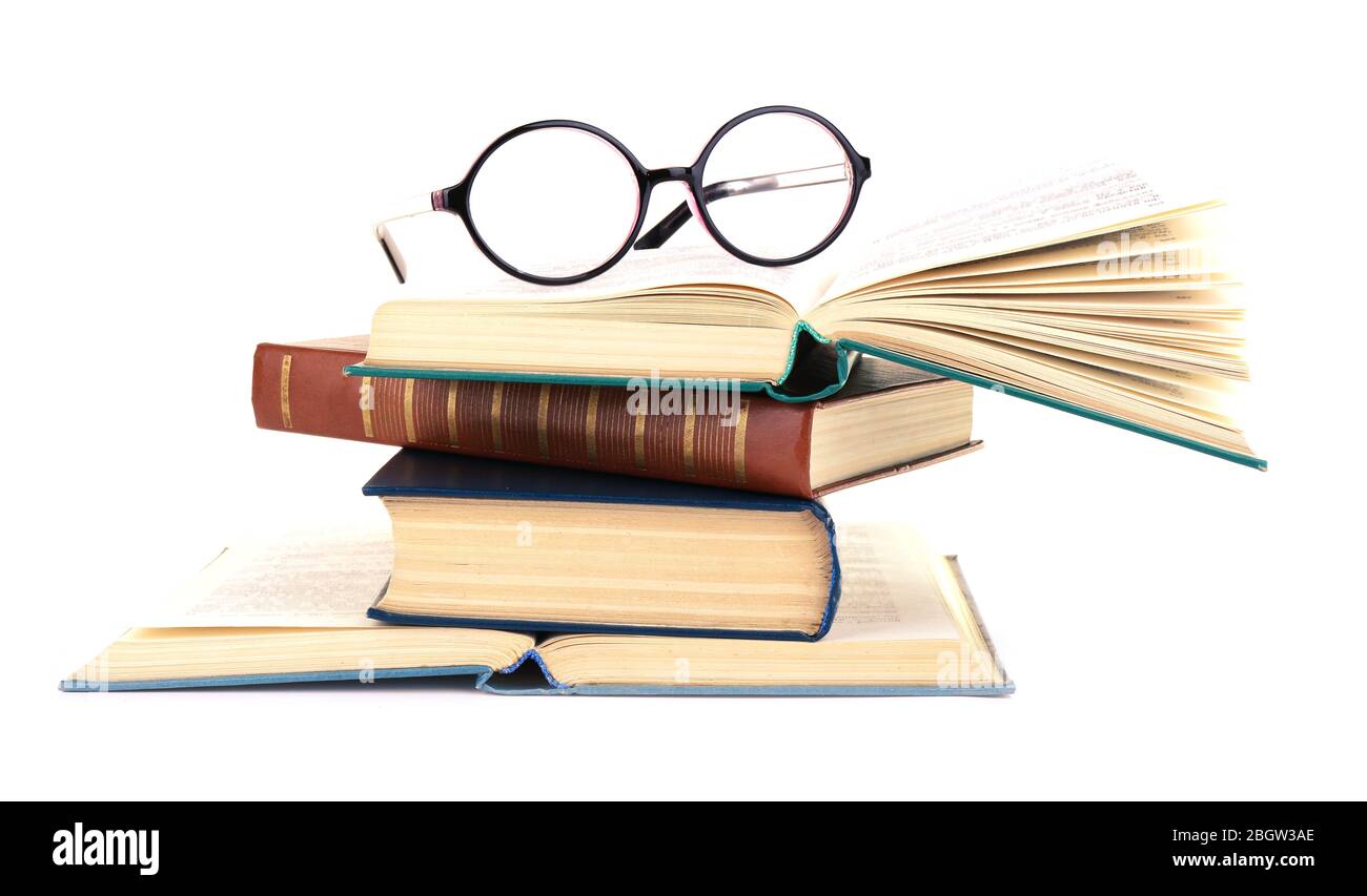Books in a mess and glasses isolated on white Stock Photo - Alamy