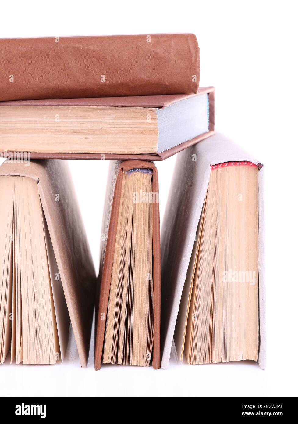Books in a mess isolated on white Stock Photo - Alamy