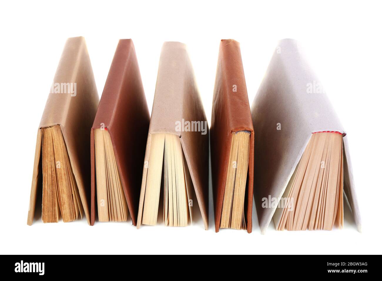 Books in a mess isolated on white Stock Photo - Alamy