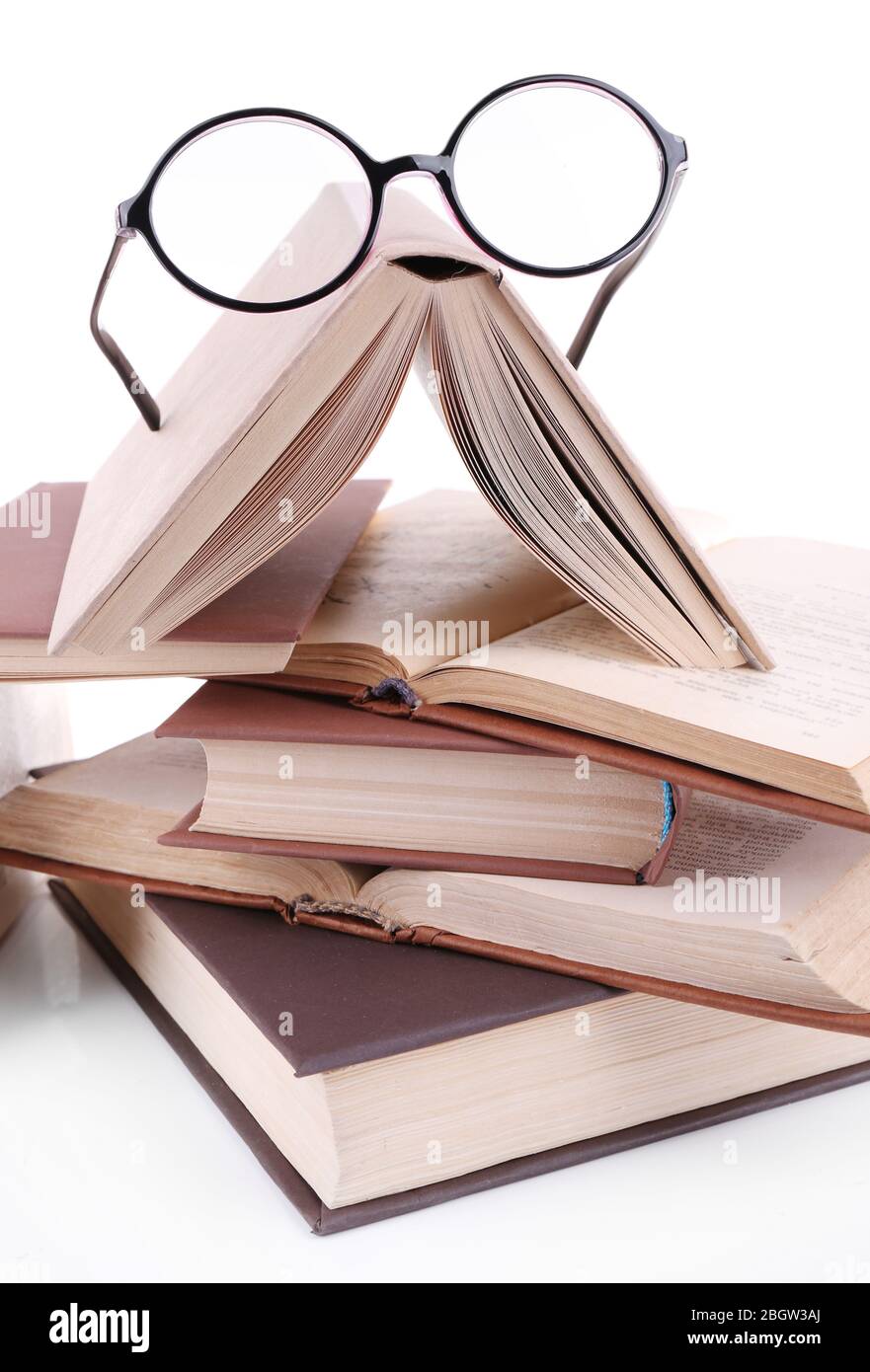 Books in a mess and glasses isolated on white Stock Photo - Alamy