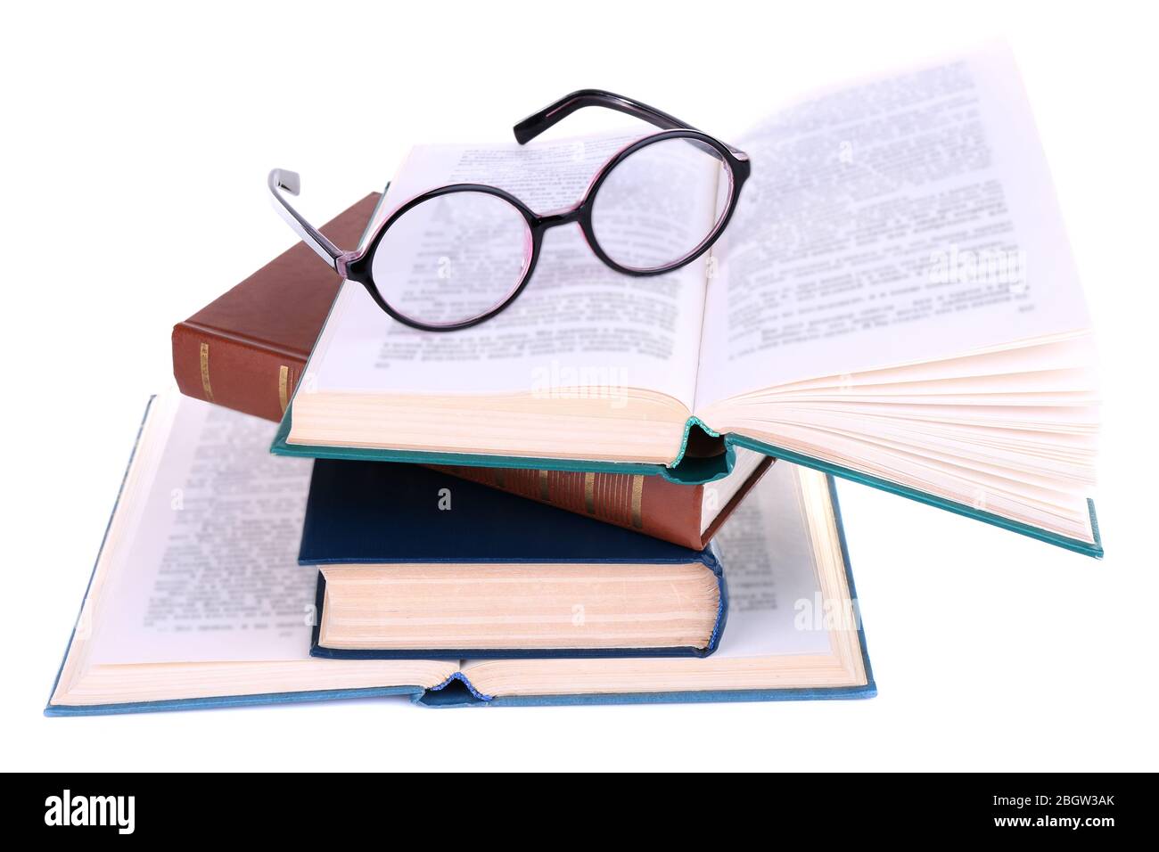 Books in a mess and glasses isolated on white Stock Photo - Alamy