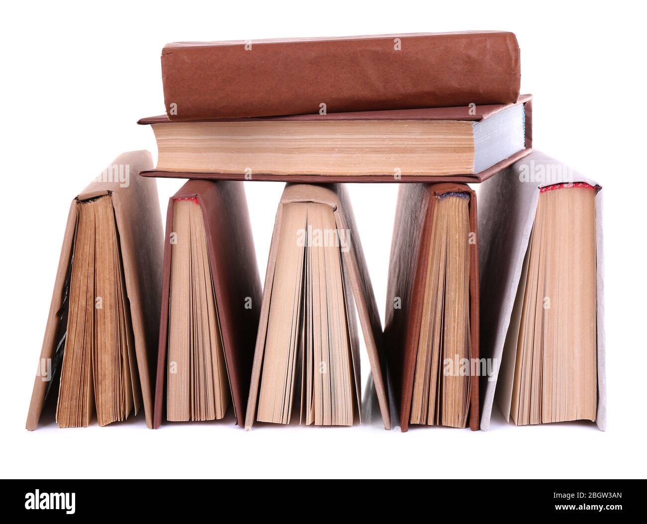 Books in a mess isolated on white Stock Photo - Alamy