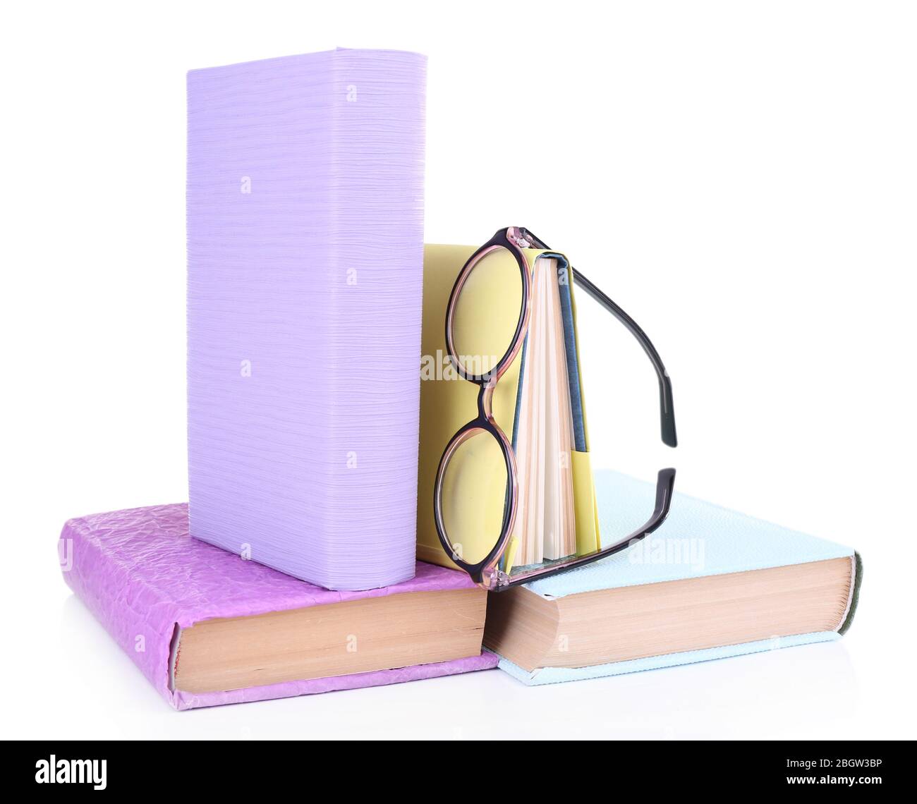 Books in a mess and glasses isolated on white Stock Photo - Alamy