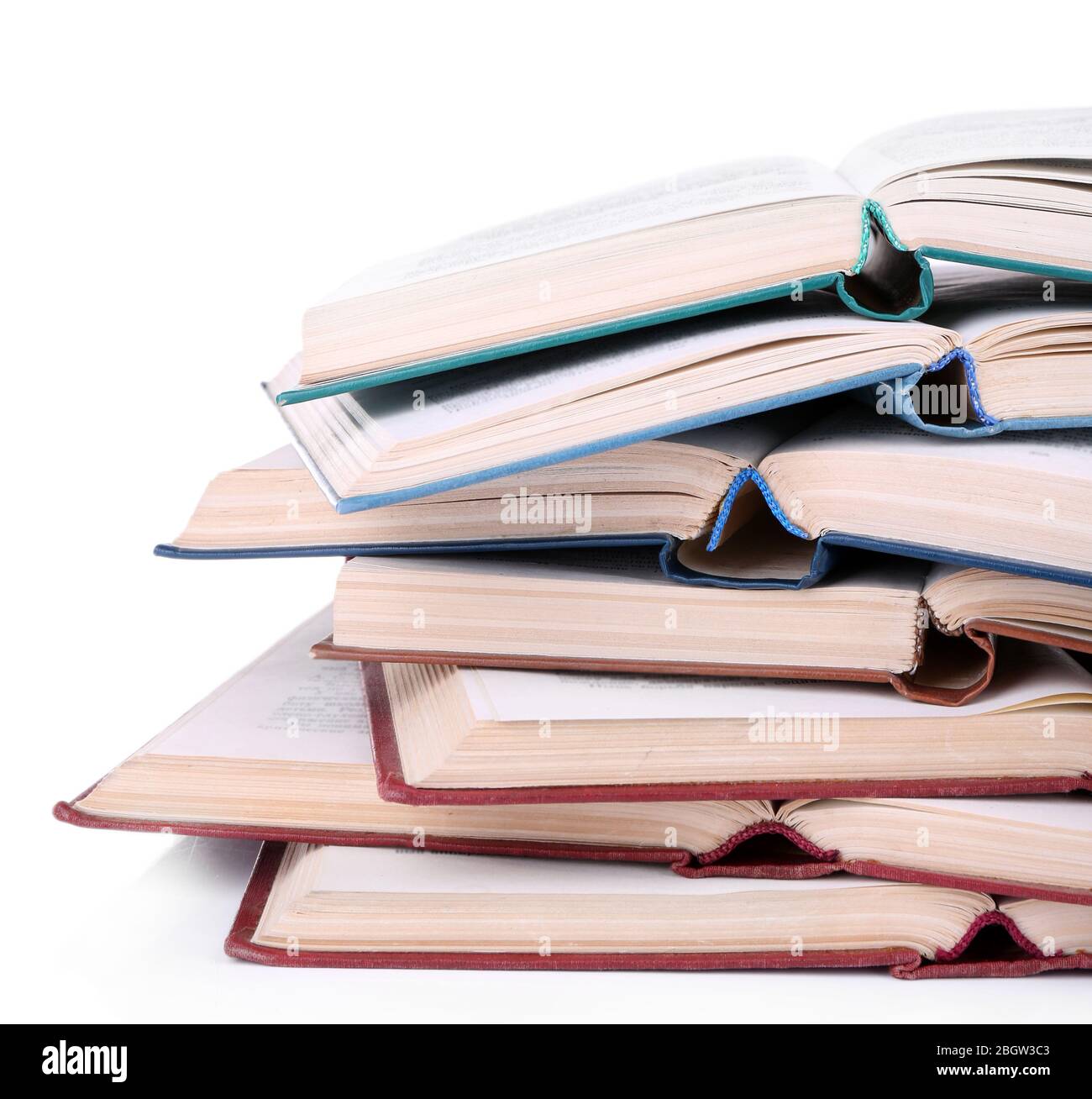 Books in a mess isolated on white Stock Photo - Alamy