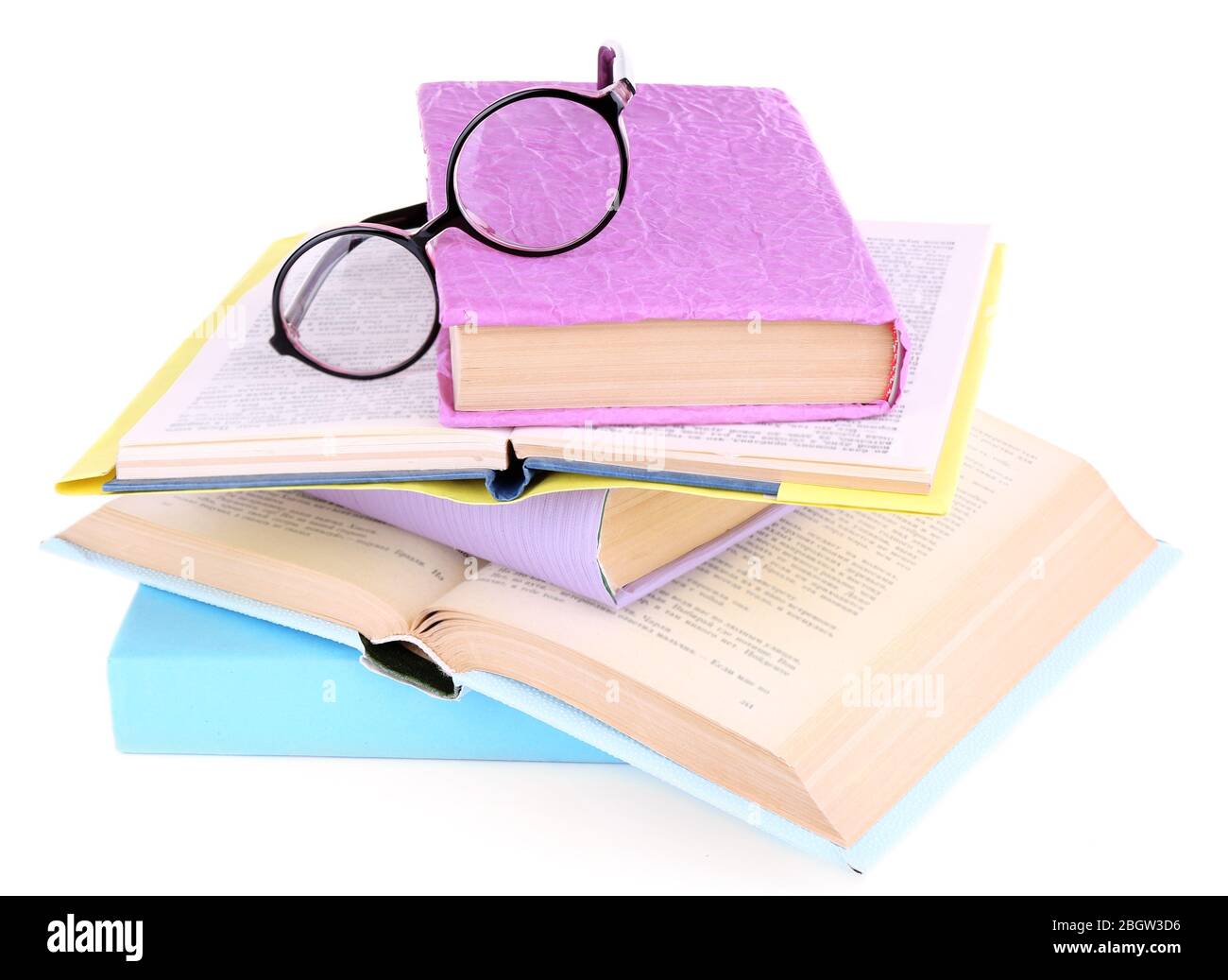 Books in a mess and glasses isolated on white Stock Photo - Alamy