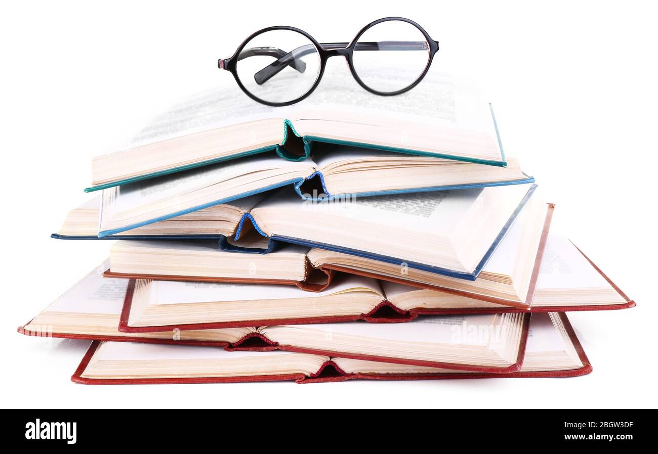 Books in a mess and glasses isolated on white Stock Photo - Alamy