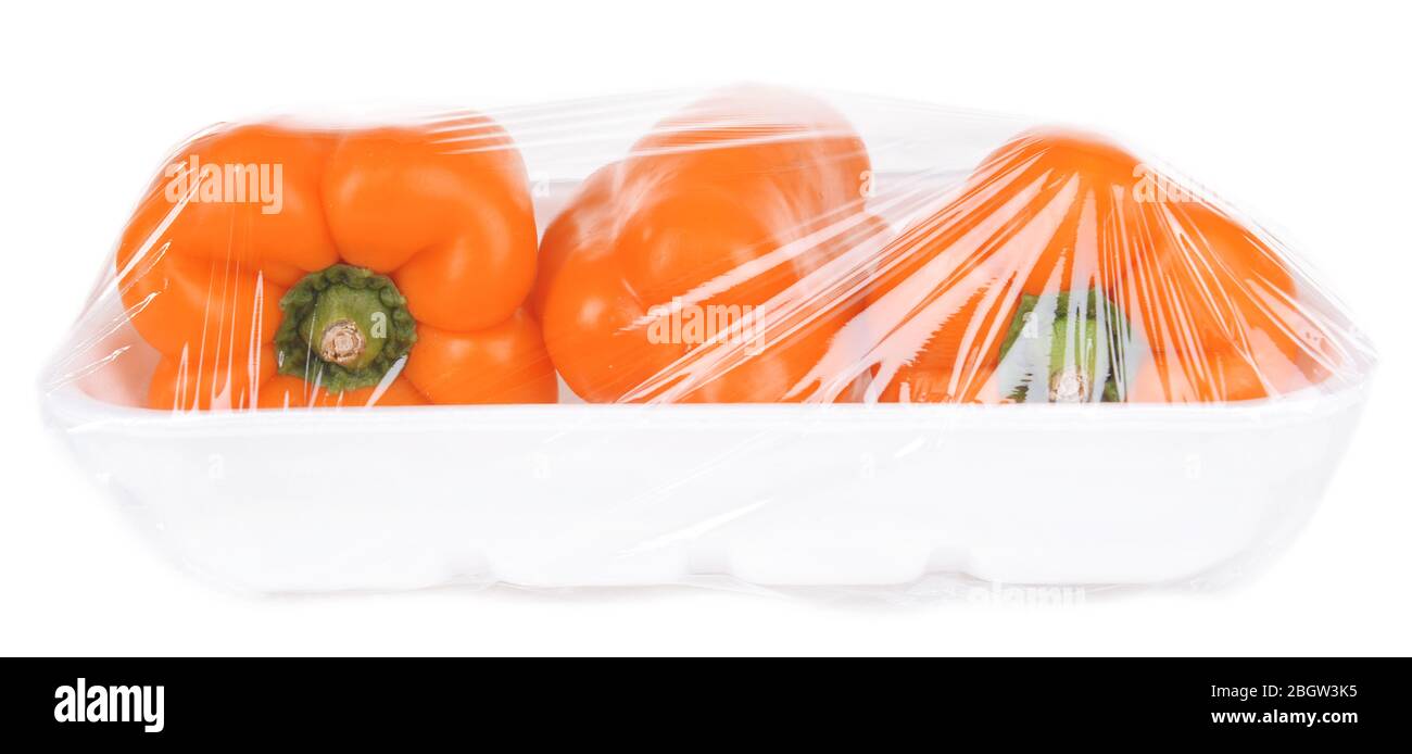 Pepper packed in food film isolated on white Stock Photo - Alamy