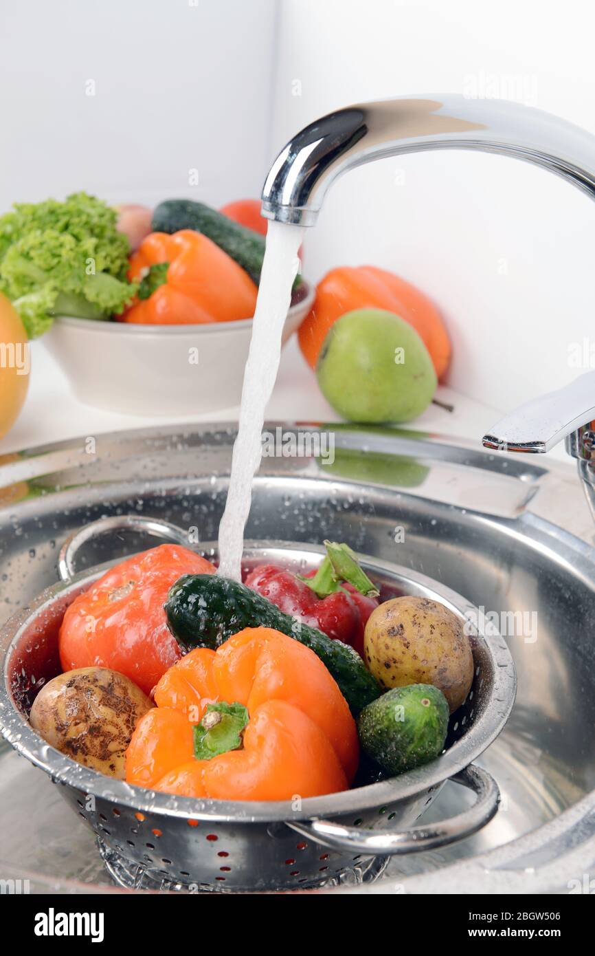 Washing fruits and vegetables close-up Stock Photo - Alamy