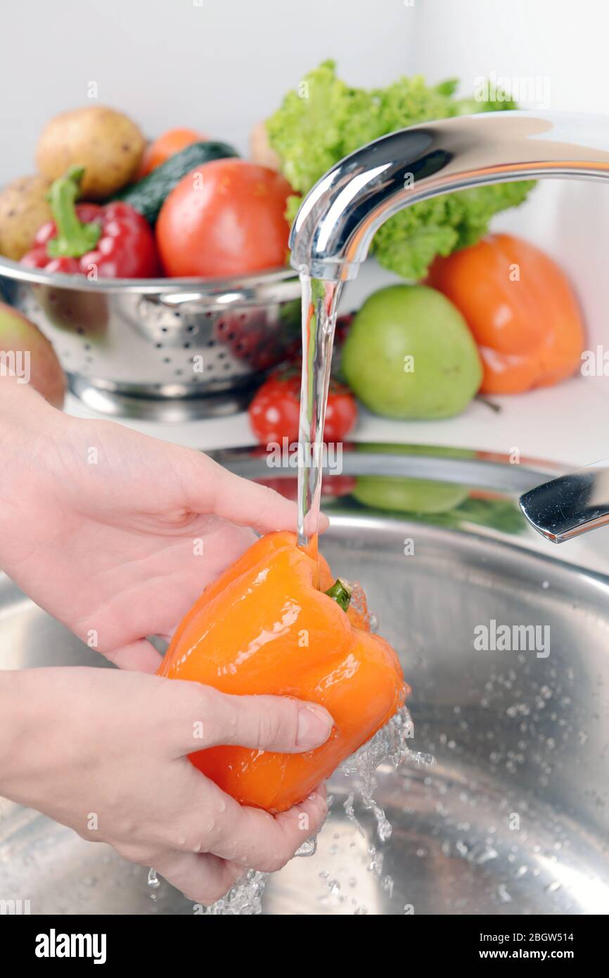 Washing fruits and vegetables close-up Stock Photo - Alamy