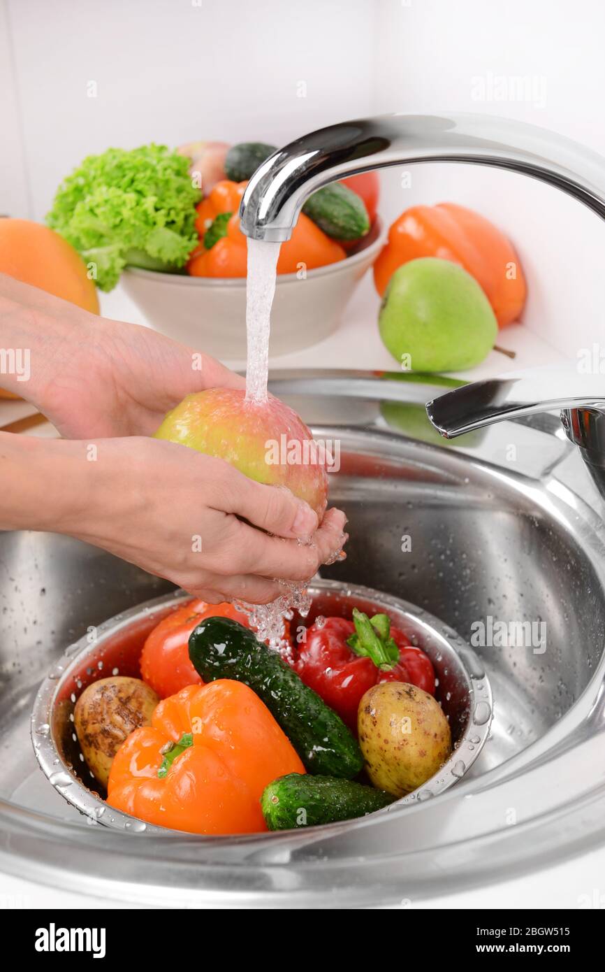 Washing fruits and vegetables close-up Stock Photo - Alamy
