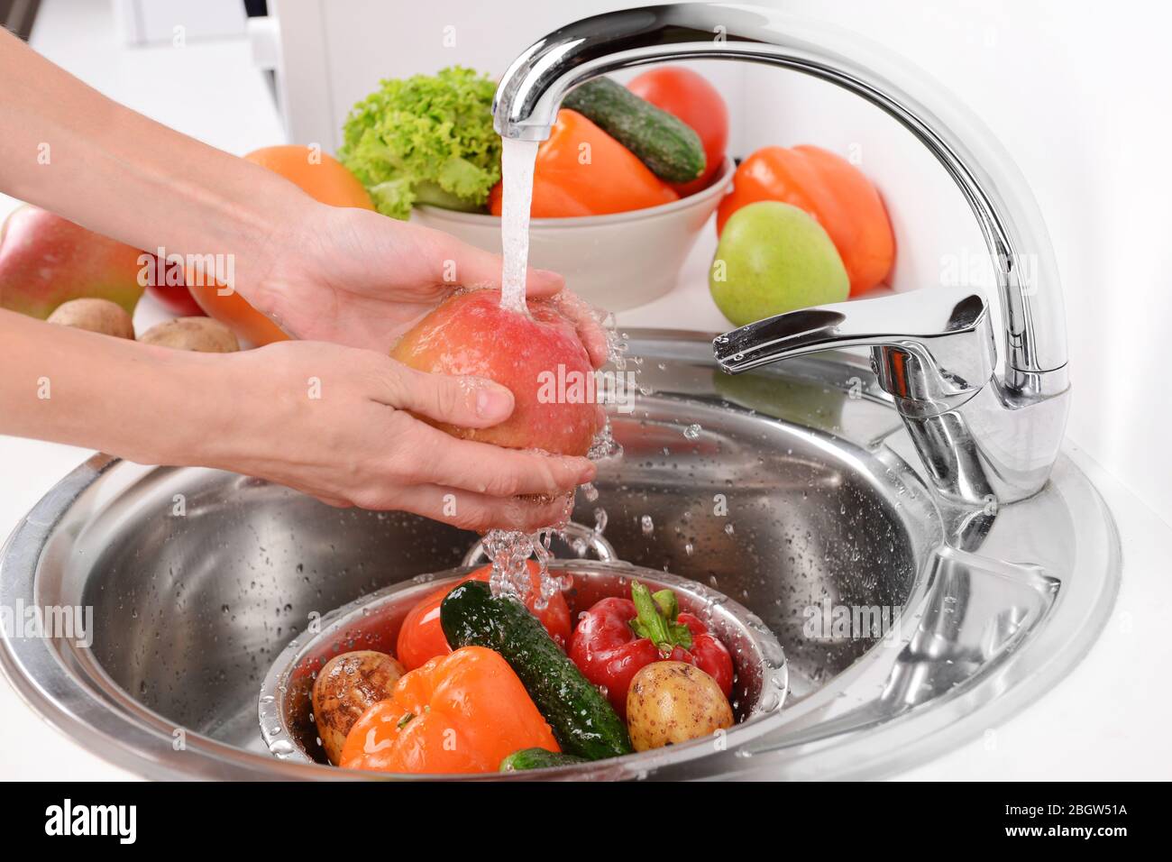 Washing fruits and vegetables close-up Stock Photo - Alamy