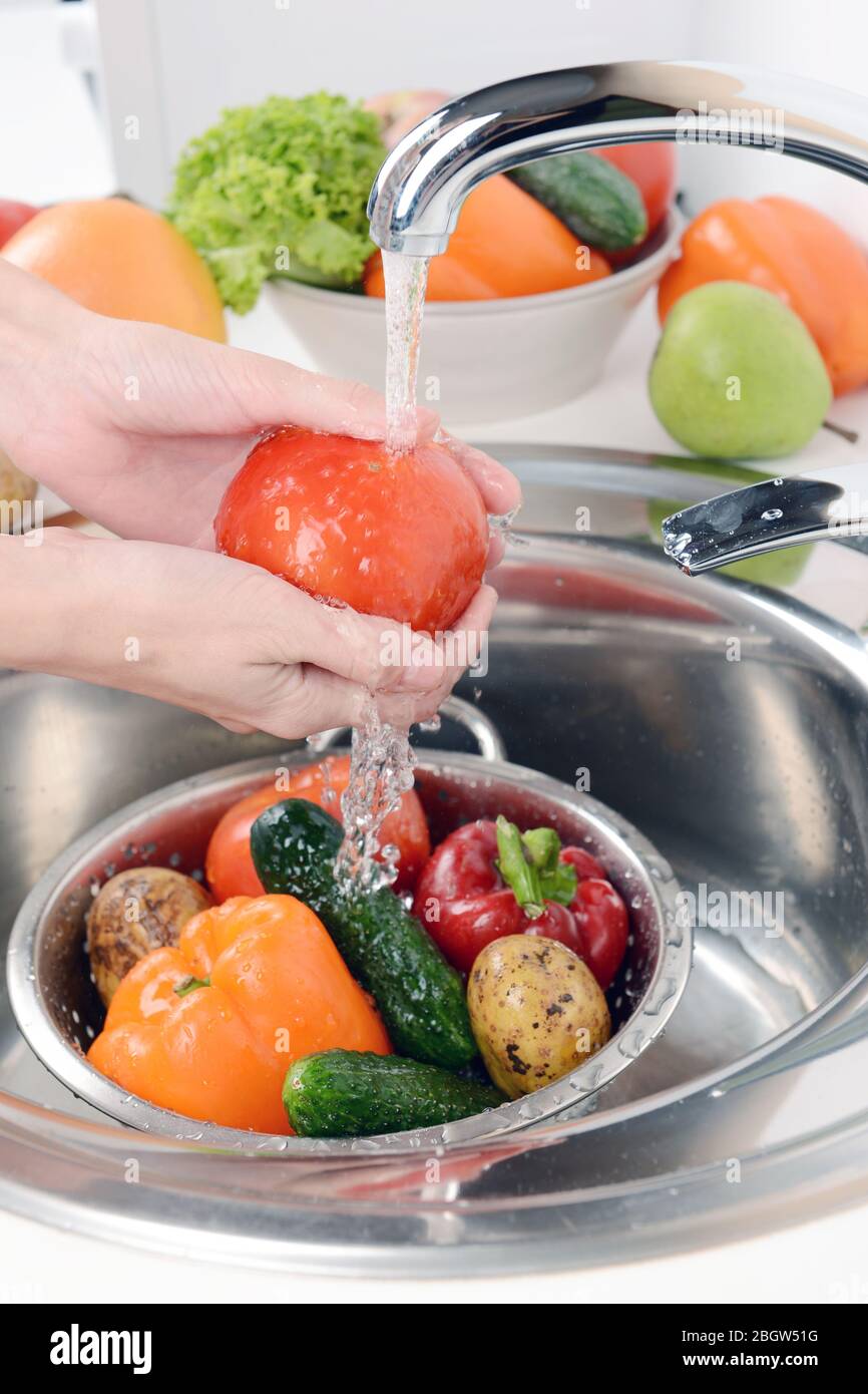 Washing fruits and vegetables close-up Stock Photo - Alamy