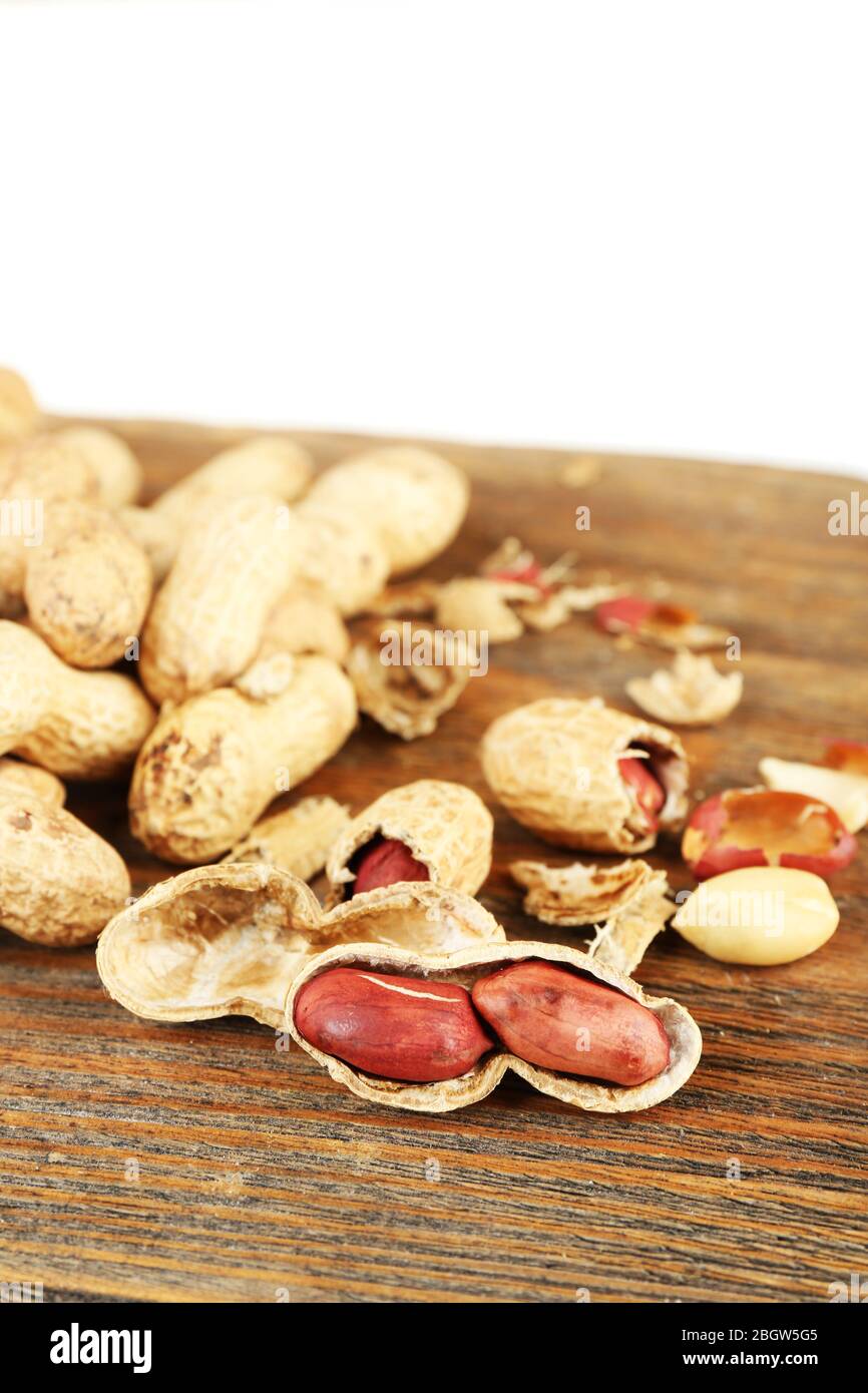 Peanuts cutting board, isolated on white background Stock Photo - Alamy