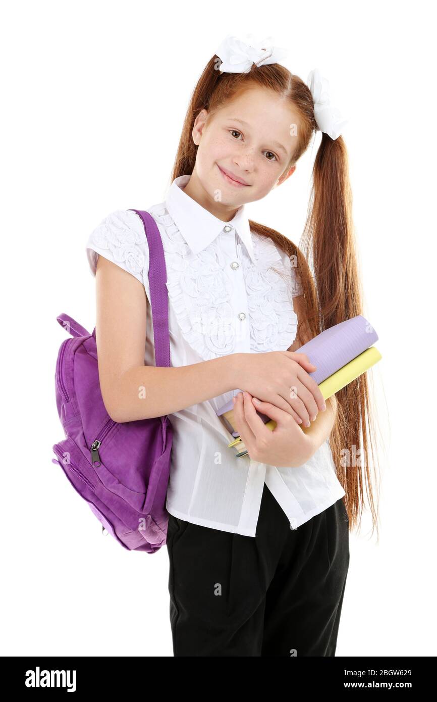 Beautiful little girl with backpack holding books isolated on white ...