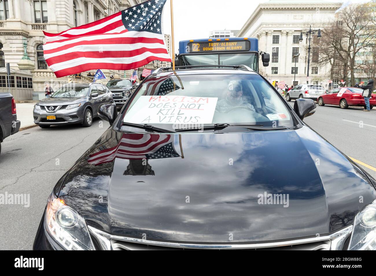 Albany, NY - April 22, 2020: People in cars and on streets with ...