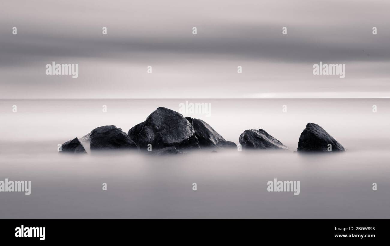 Coastal rocks mono long exposure- Happisburgh, June 2017 Stock Photo ...