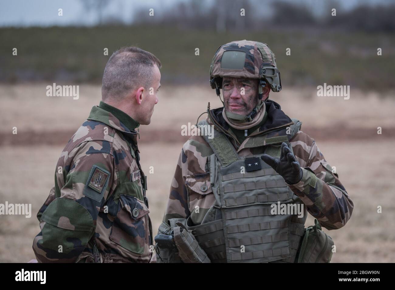 TOULOUSE, FRANCE - FEBRUARY 09: two soldiers talking each other during ...