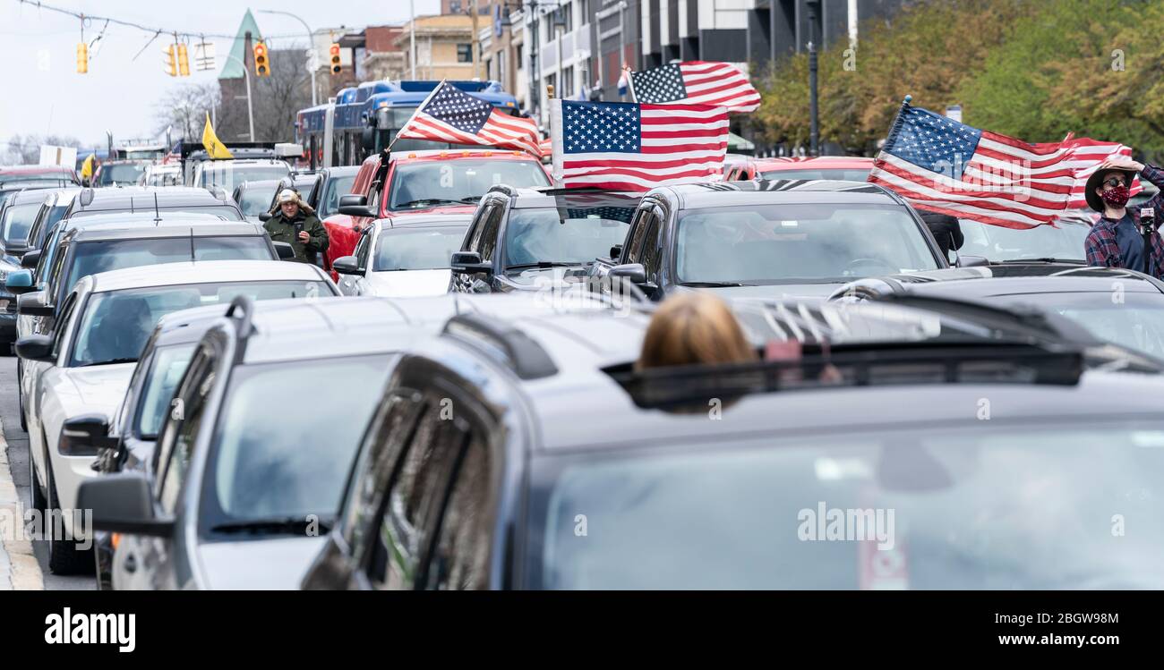Albany, NY - April 22, 2020: People in cars and on streets with ...