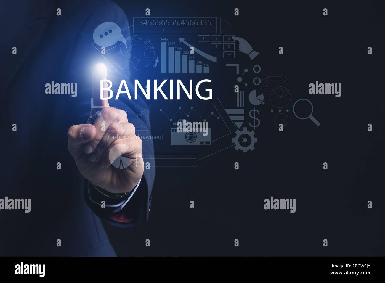 Male bank manager using virtual screen on dark background Stock Photo ...