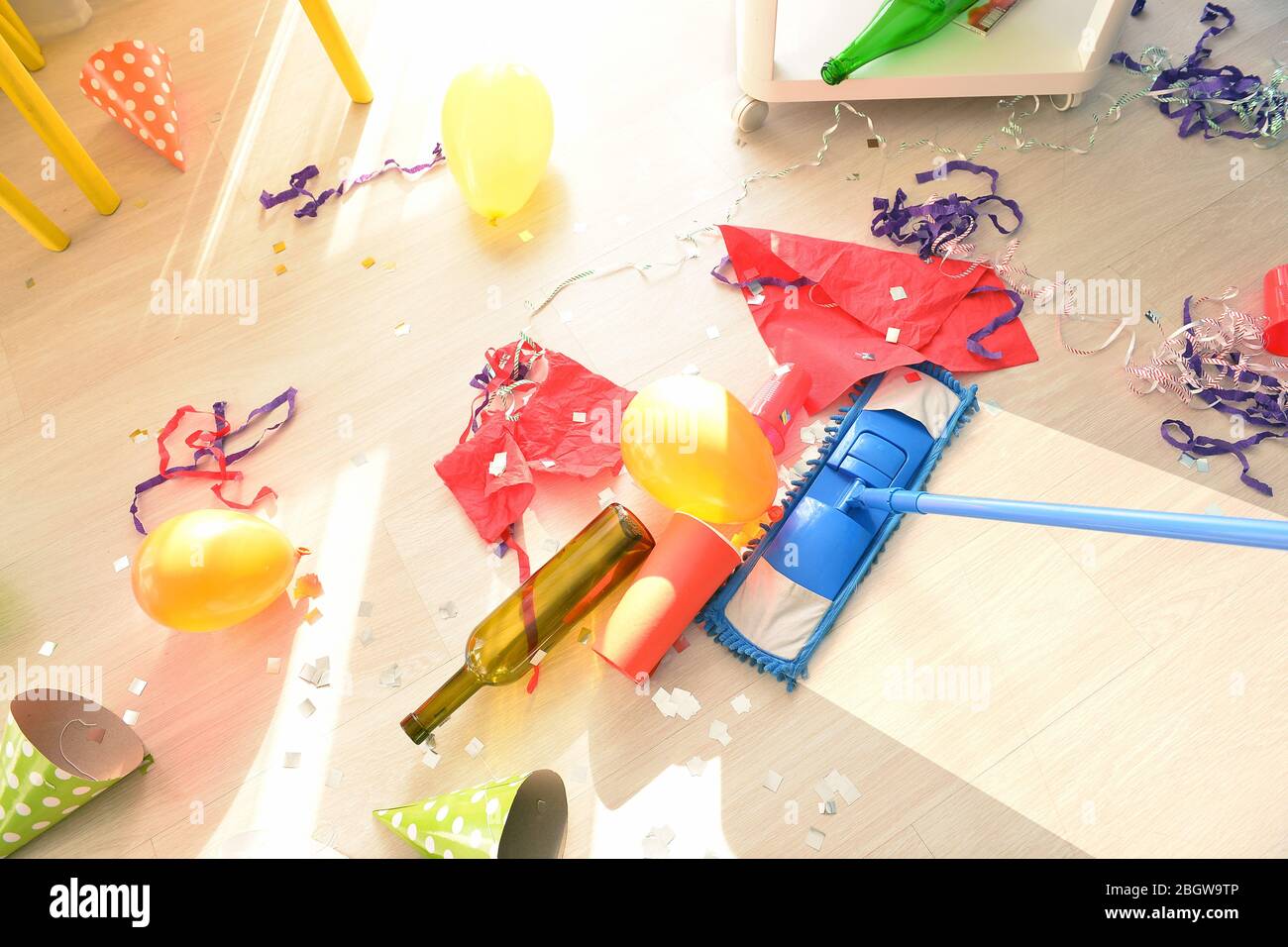 Cleaning of room in terrible mess after party Stock Photo - Alamy