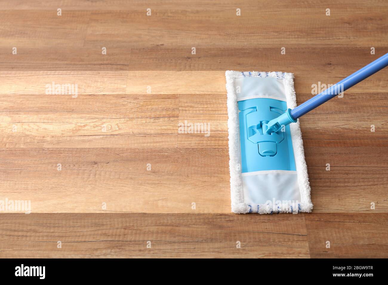 Cleaning of floor with mop Stock Photo - Alamy
