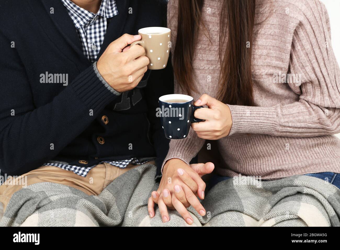 Loving couple with hot drinks Stock Photo - Alamy