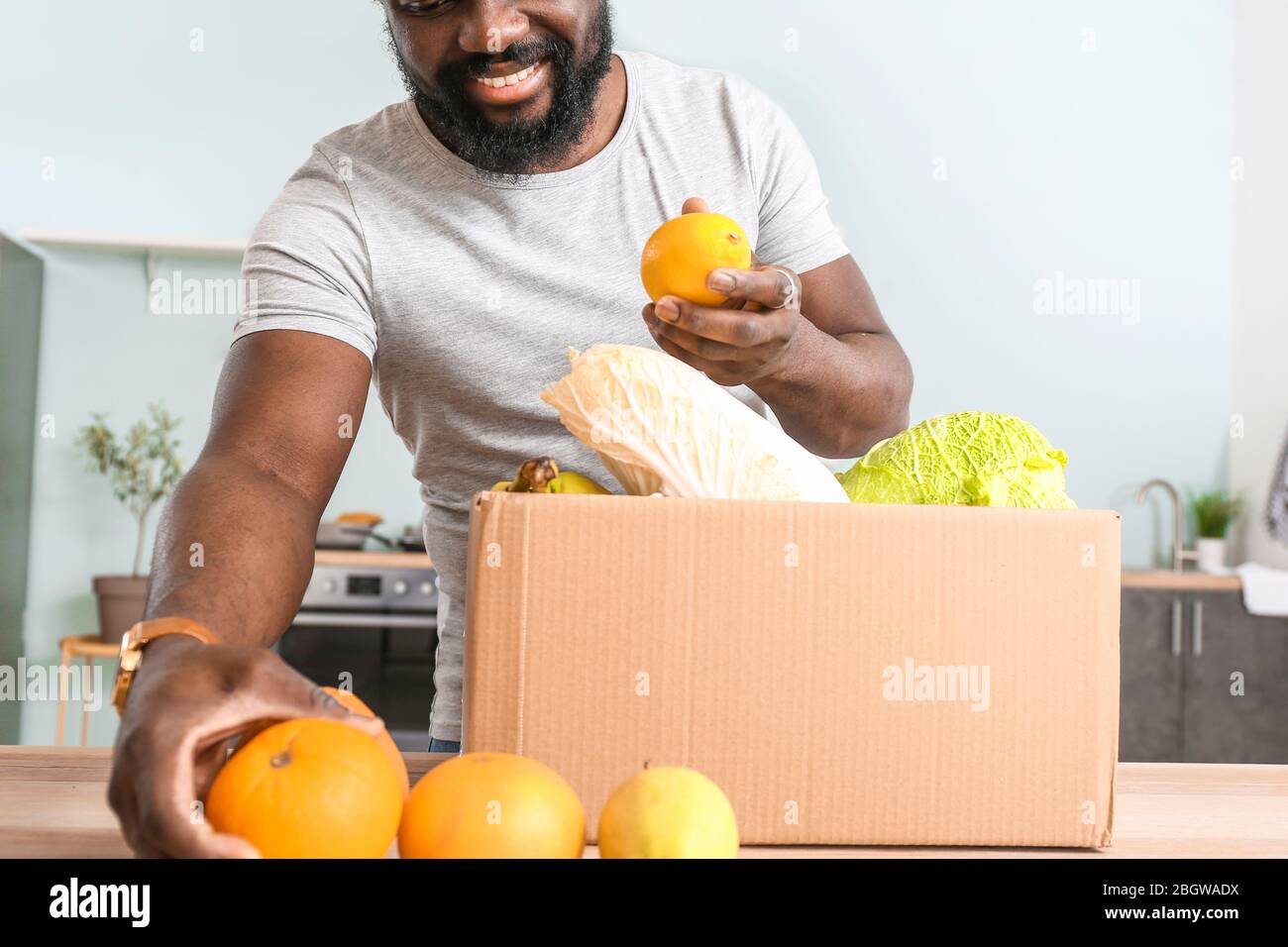 African man unpacking store hi-res stock photography and images - Alamy