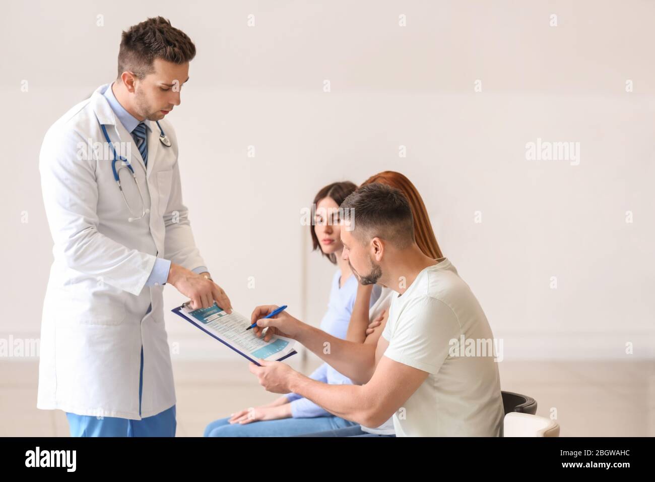 Male doctor waiting patients hi-res stock photography and images - Alamy