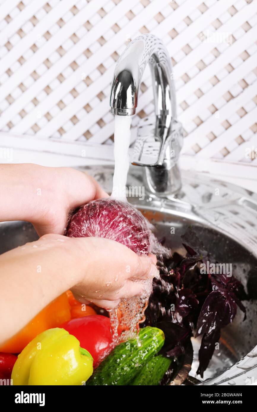 Woman washing different vegetables hi-res stock photography and images ...